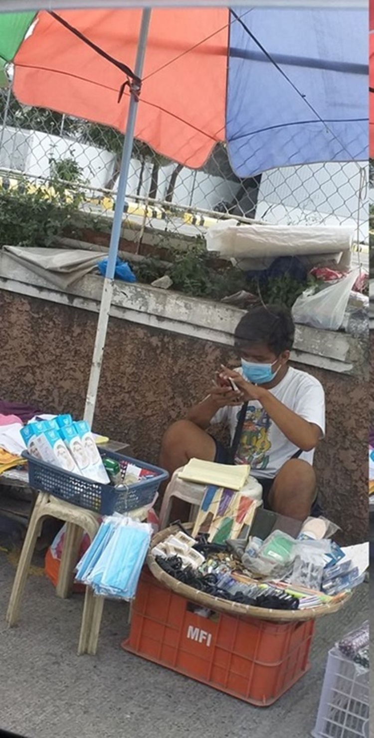 Determined Student Attends Online Class While Working as Street Vendor